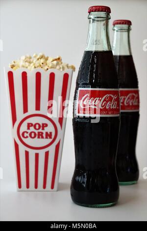 Full Bowl of Popcorn and glass of Cola isolated on white background ...