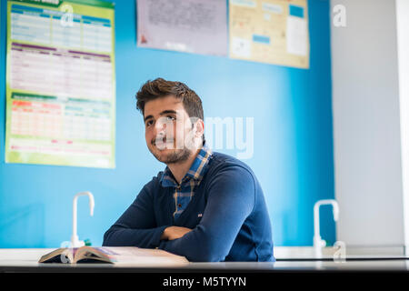 a young middle eastern science student is photographed in the physics ...