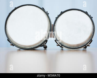 A set of wooden bongos isolated on a white background Stock Photo - Alamy