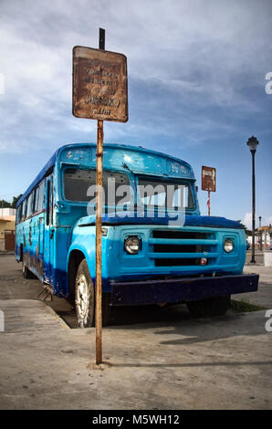 rusty retro car blue color stands behind the old fencing wire Stock ...