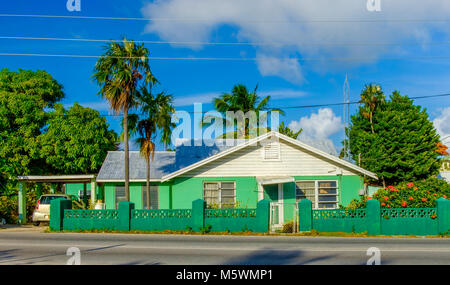Caribbean-style house with a corrugated tin roof and a veranda in ...