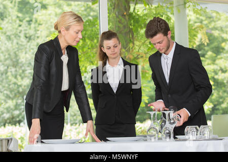 waitress and waiter during training Stock Photo - Alamy