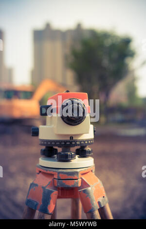 Laser rangefinder at a construction site. Measuring tool at a ...