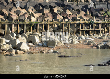 Concrete riprap and timber coastal defences, Seaford, UK Stock Photo ...