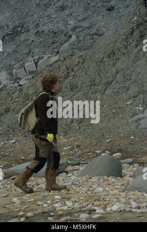 Young Handsome British Geologist, Fossil Hunting on Charmouth Beach ...