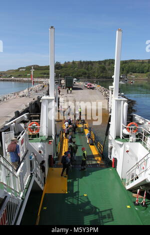 Passengers disembark the CalMac ferry at the Isle of Eigg, Small Isles ...