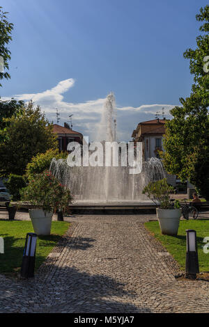 town fountain, front view with meadow Stock Photo - Alamy