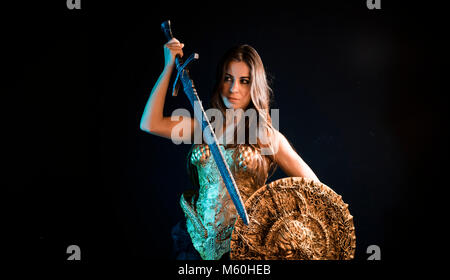 Medieval, valkyrie warrior, woman with golden armor iron coat and big ...