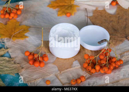 Face cream with rowan berries extract. Closeup Stock Photo - Alamy