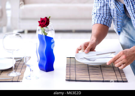 Man alone preparing for romantic date with his sweetheart Stock Photo ...