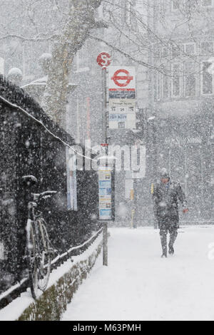 Pedestrians walk through a snow storm on Boxing Day in Toronto, on ...