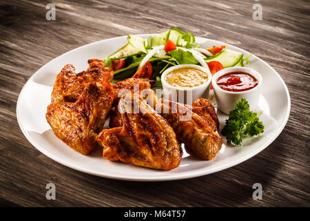 Grilled chicken wigs Stock Photo - Alamy