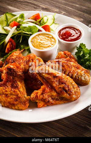 Grilled chicken wigs Stock Photo - Alamy