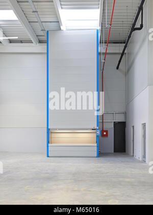 Vertical carousel storage unit in distribution warehouse Stock Photo ...