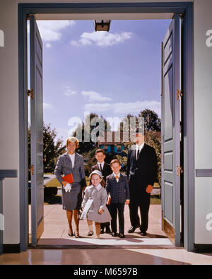 Preteen boy in space suit pointing up while sitting with raised arms on ...