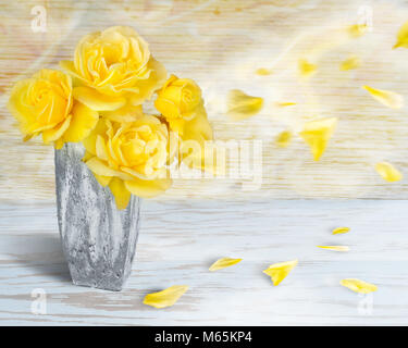 beautiful yellow roses against a stone wall Stock Photo - Alamy