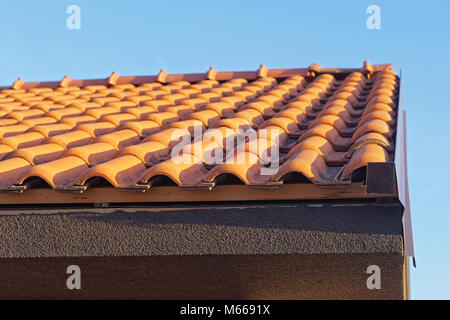 New orange roof tiles house top Stock Photo - Alamy
