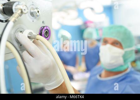 surgery assistant perfusionist operating a modern heart lung machine ...