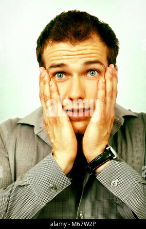 Portrait of worried manager looking at watch with astonished expression ...