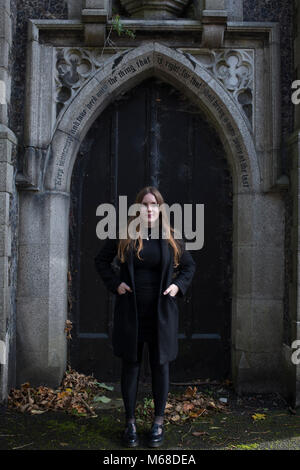 a female funeral director stands in a brighton gothic victorian ...