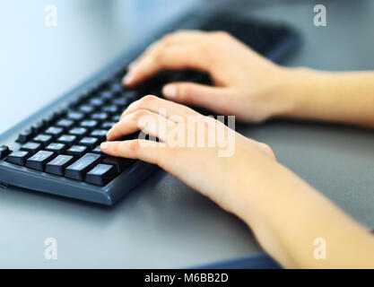 Close-up shot of a female learner typing on the keyboard Stock Photo ...