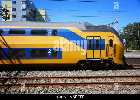 ZAANDAM, NETHERLANDS - JULY 9, 2017: Nederlandse Spoorwegen (NS) train ...
