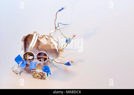Repairing damaged sockets, installing new Stock Photo - Alamy