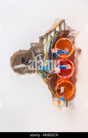 Repairing damaged sockets, installing new Stock Photo - Alamy