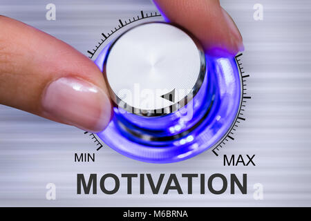 Close-up Of A Human Hand Maximizing Performance Knob Stock Photo - Alamy