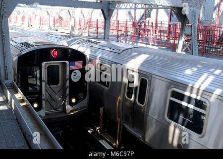 Subway cars crossing the Williamsburg Bridge between Brooklyn and Manhattan in New York City ...