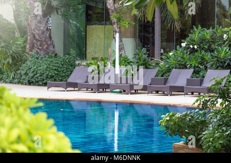 Luxury pool bed beside the swimming pool Stock Photo - Alamy