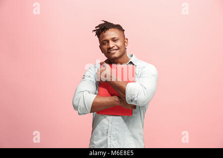 Afro-American Businessman hugging laptop Stock Photo - Alamy