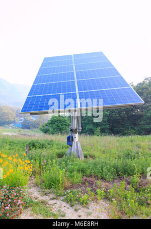 Solar energy panels on a slanting roof England UK Stock Photo - Alamy