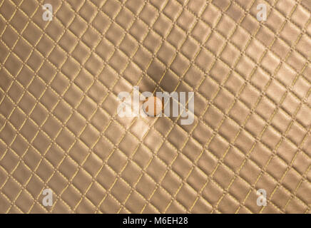 Yellow or gold leather upholstery sofa with pattern button design ...