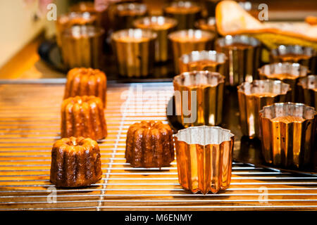 French Pastry Canneles. Preparation of a Breton specialty Stock Photo ...