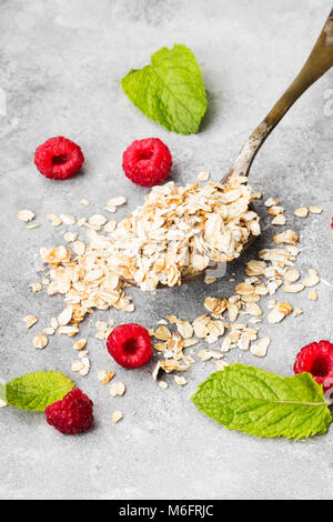 Glanola with raspberry and mint. Food background Stock Photo - Alamy