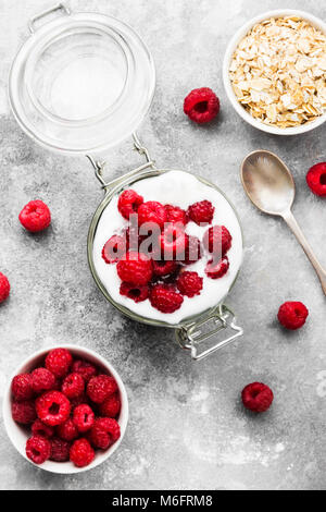 Glanola with raspberry and mint. Food background Stock Photo - Alamy