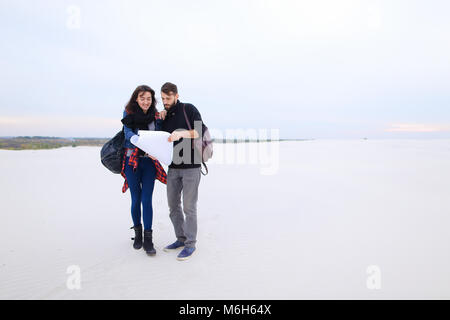 Presenters of travel program married couple viewing map Stock Photo - Alamy