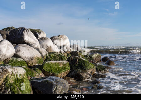 Ice-covered rocks; groyne on Saeby Beach, Denmark Stock Photo - Alamy