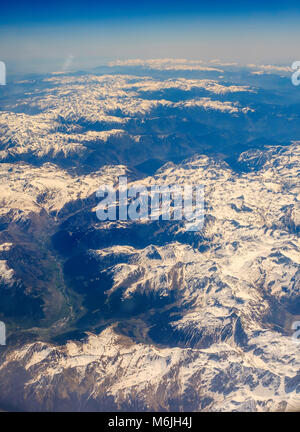 Air view of the snow-capped Pyrenees mountains in Andora, a small ...