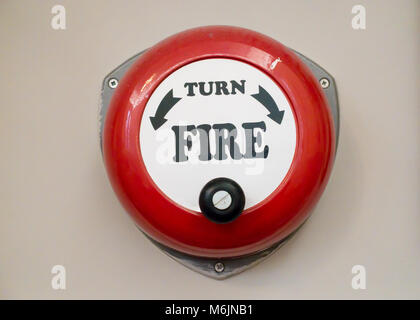 Old fashioned hand cranked manual fire alarm bell mounted on wall Stock ...