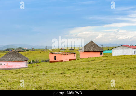 Xhosa round huts or houses or rondavels with thatched roofs ...