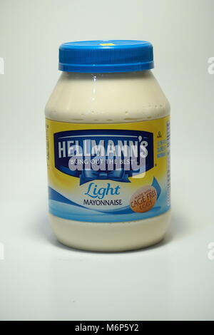 Plastic jar of Hellmann's real mayonnaise spread on dark background ...
