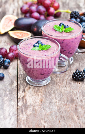 fresh healthy pulpy cocktail with purple fruits and berries Stock Photo ...