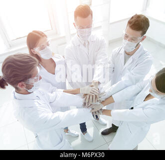 Health care workers demonstrating unity, bottom view Stock Photo - Alamy
