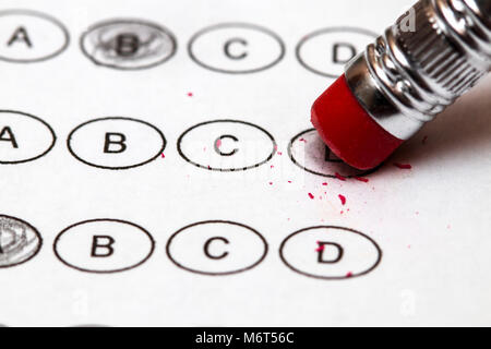 Pencil on answer sheets or Standardized test form with answers bubbled ...