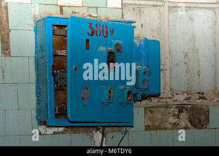 old rusty transformer substation against the blue sky, vertical Stock ...