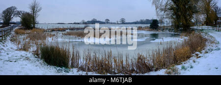 Frozen farm pond Stock Photo - Alamy