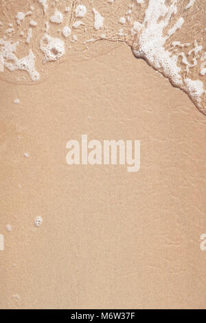 Transparent soft wave on sandy beach Stock Photo - Alamy