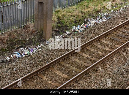 Drinks cans and plastic bottles rubbish thrown away and dumped in canal ...